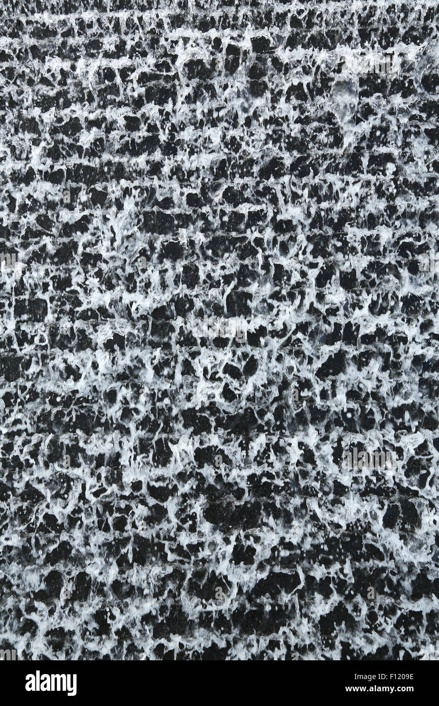 Waterfall flowing over dark rock hi-res stock photography and images ...