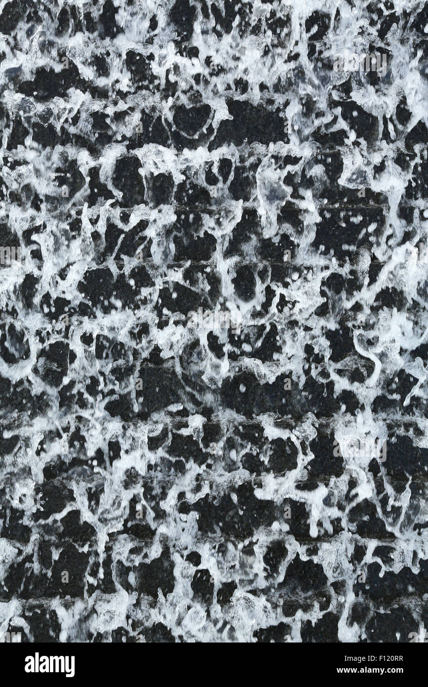 Waterfall flowing over dark rock hi-res stock photography and images ...