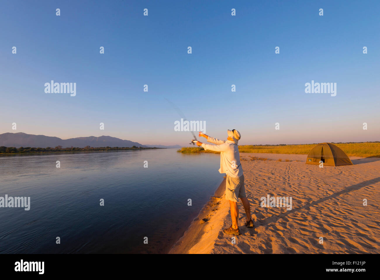 Reeling large fish hi-res stock photography and images - Alamy