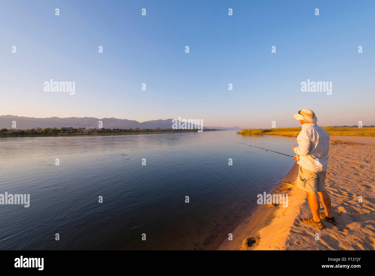 Reeling large fish hi-res stock photography and images - Alamy