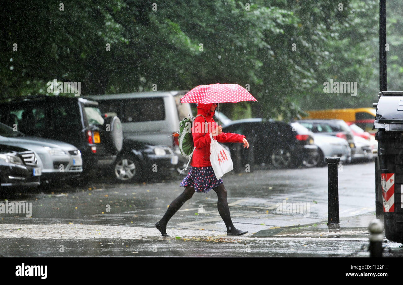 Woman caught in rain hi-res stock photography and images - Alamy