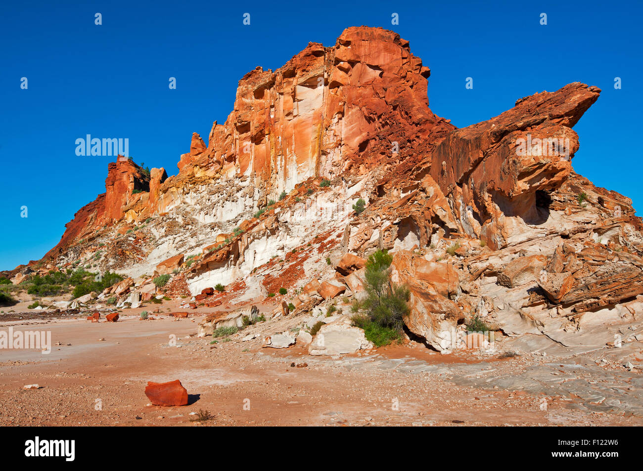 Towering rock wall of Rainbow Valley in Central Australia Stock Photo ...