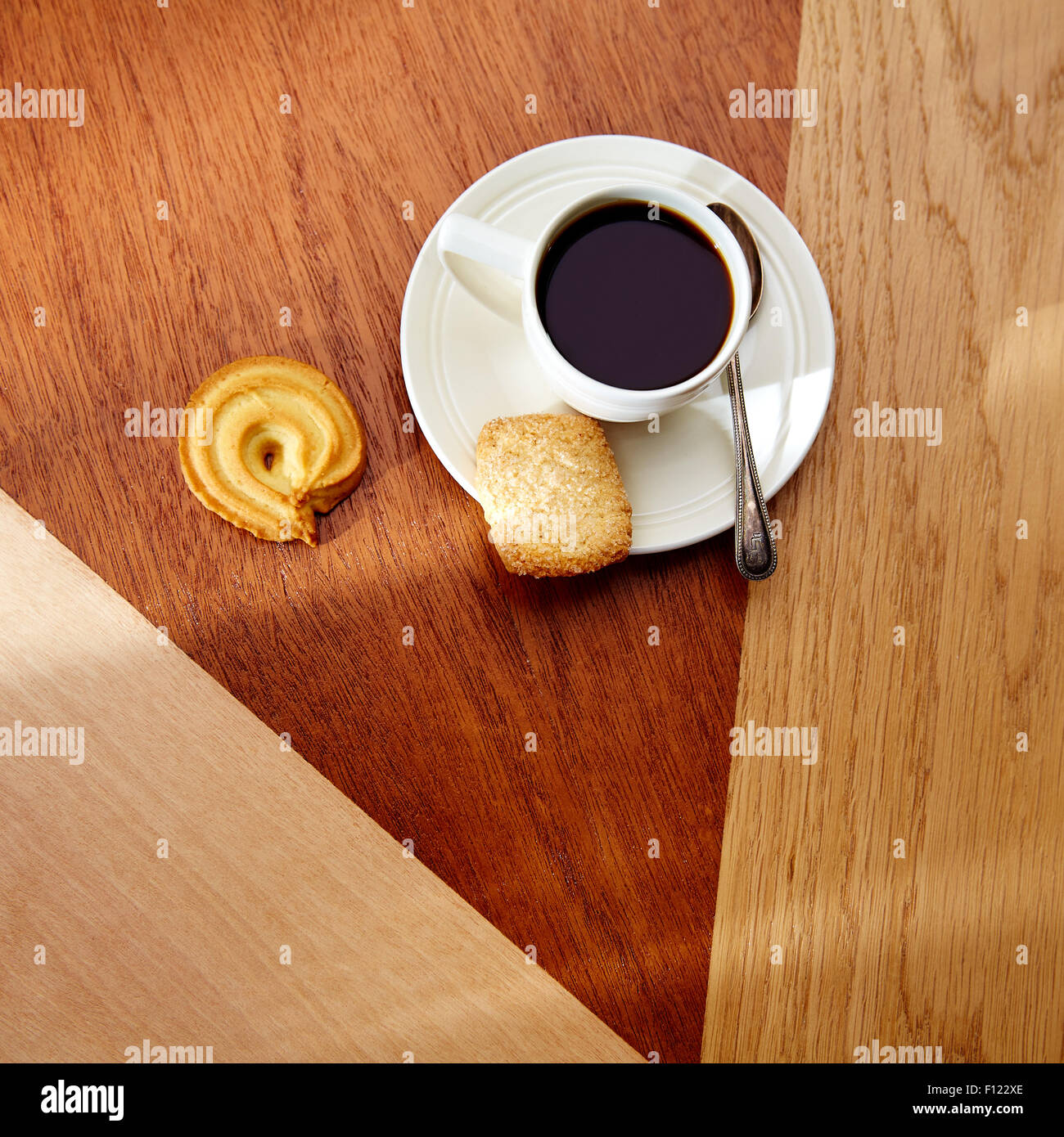 Coffee morning with biscuits on wooden modern table Stock Photo - Alamy