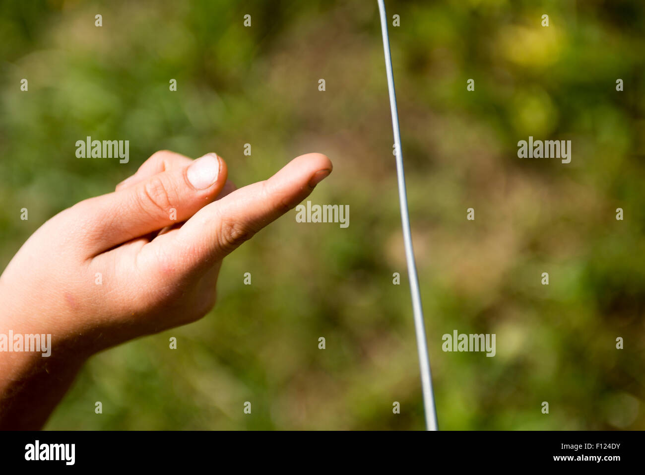 Child touching grass High Resolution Stock Photography and Images - Alamy