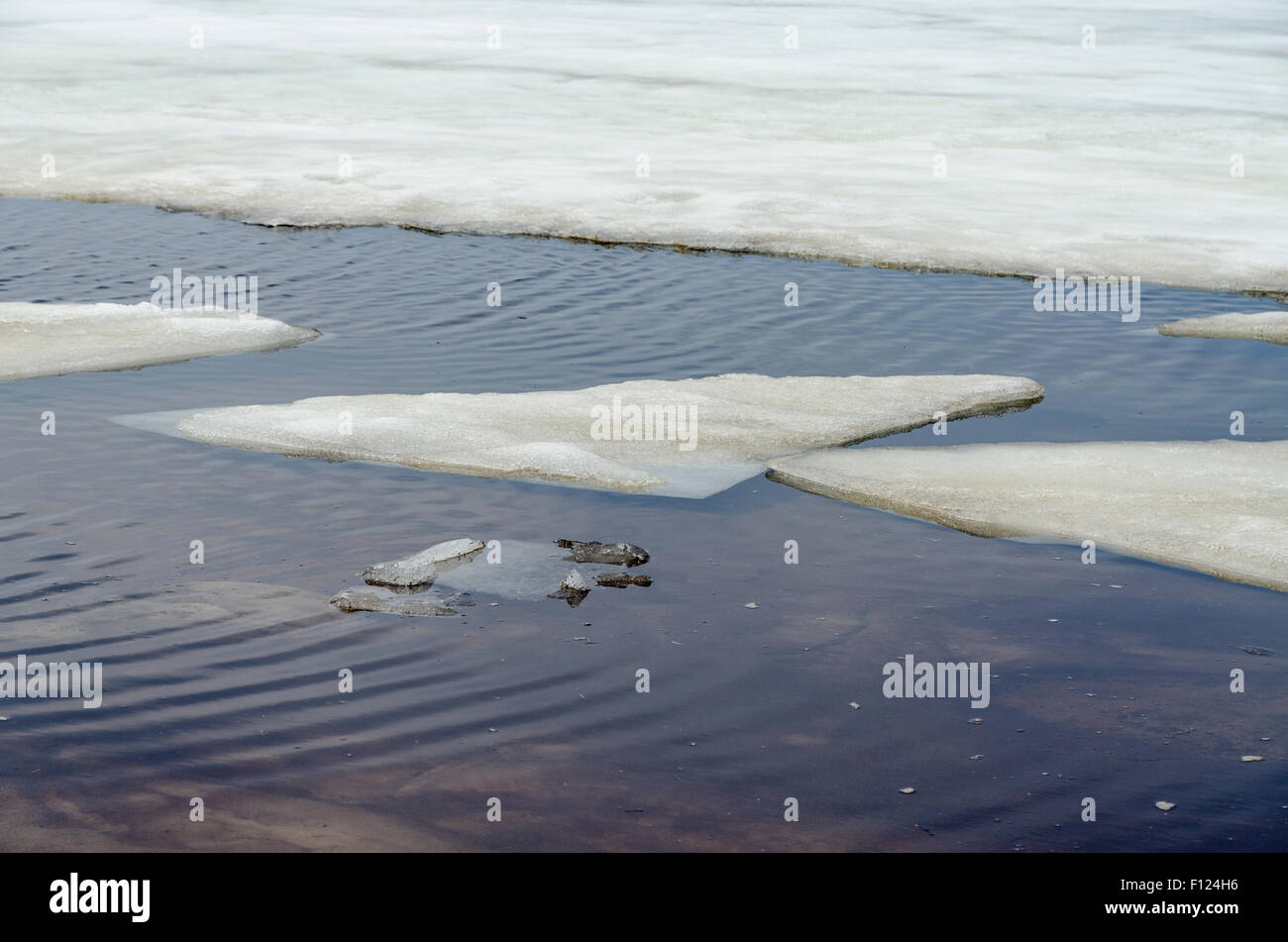 Melting ice on sandy beach of Upper Peninsula, Michigan Stock Photo - Alamy