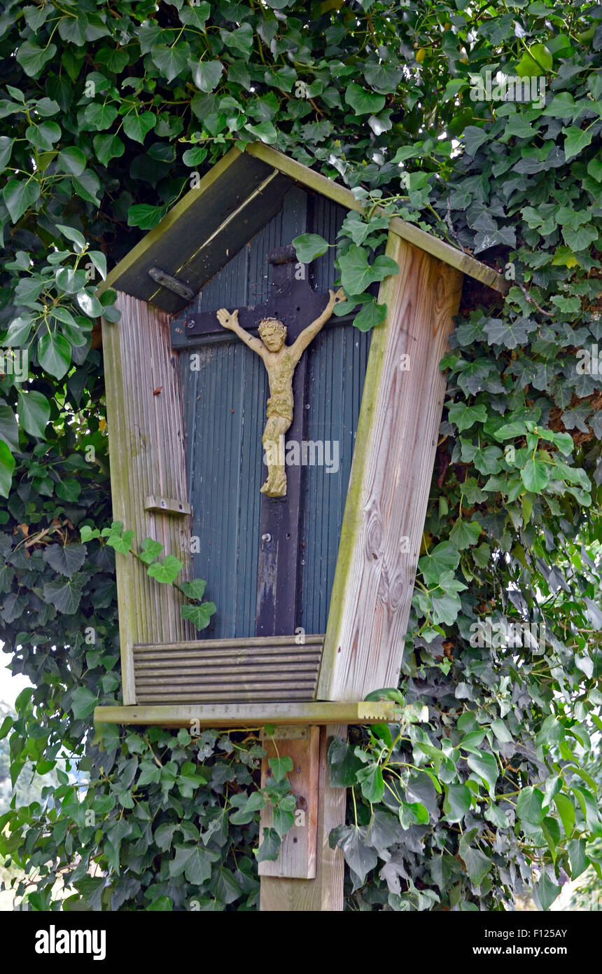 A typical rural French religious shrine in the garden of an old ...