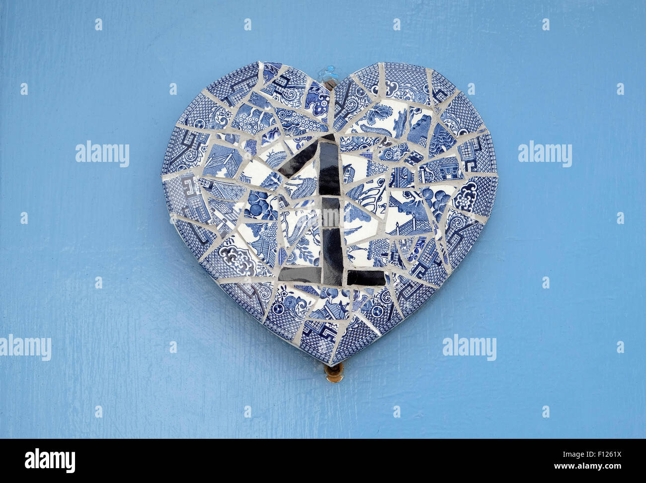 house number one made from broken crockery Stock Photo - Alamy