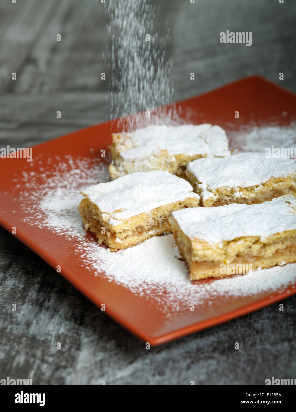 Fresh homemade apple pie - pouring sugar on it Stock Photo - Alamy