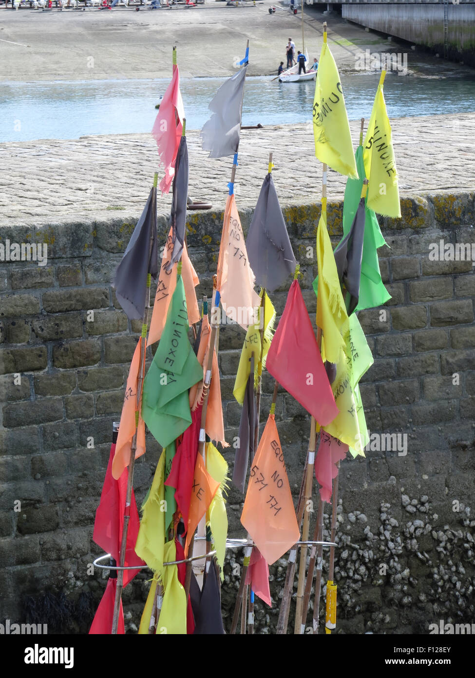 La Trinité-sur-Mer: fishing boat buoys & flags Stock Photo - Alamy
