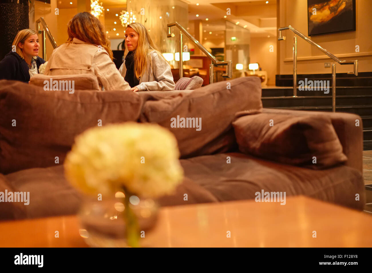 Three Young Women Sitting in London Hotel Reception Foyer Stock Photo ...