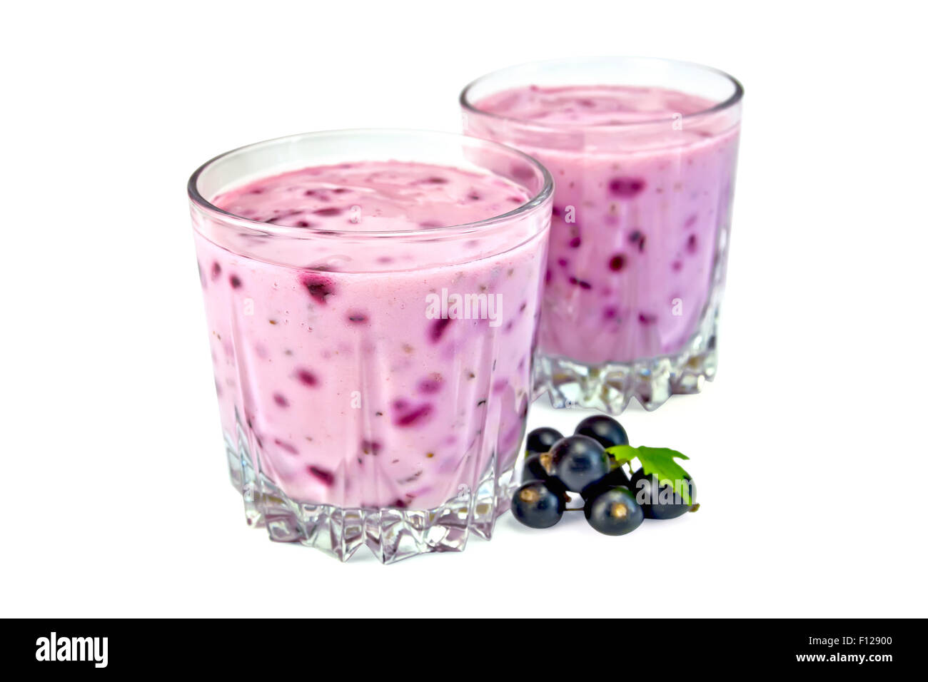 Milkshake with black currants in two glass Stock Photo - Alamy