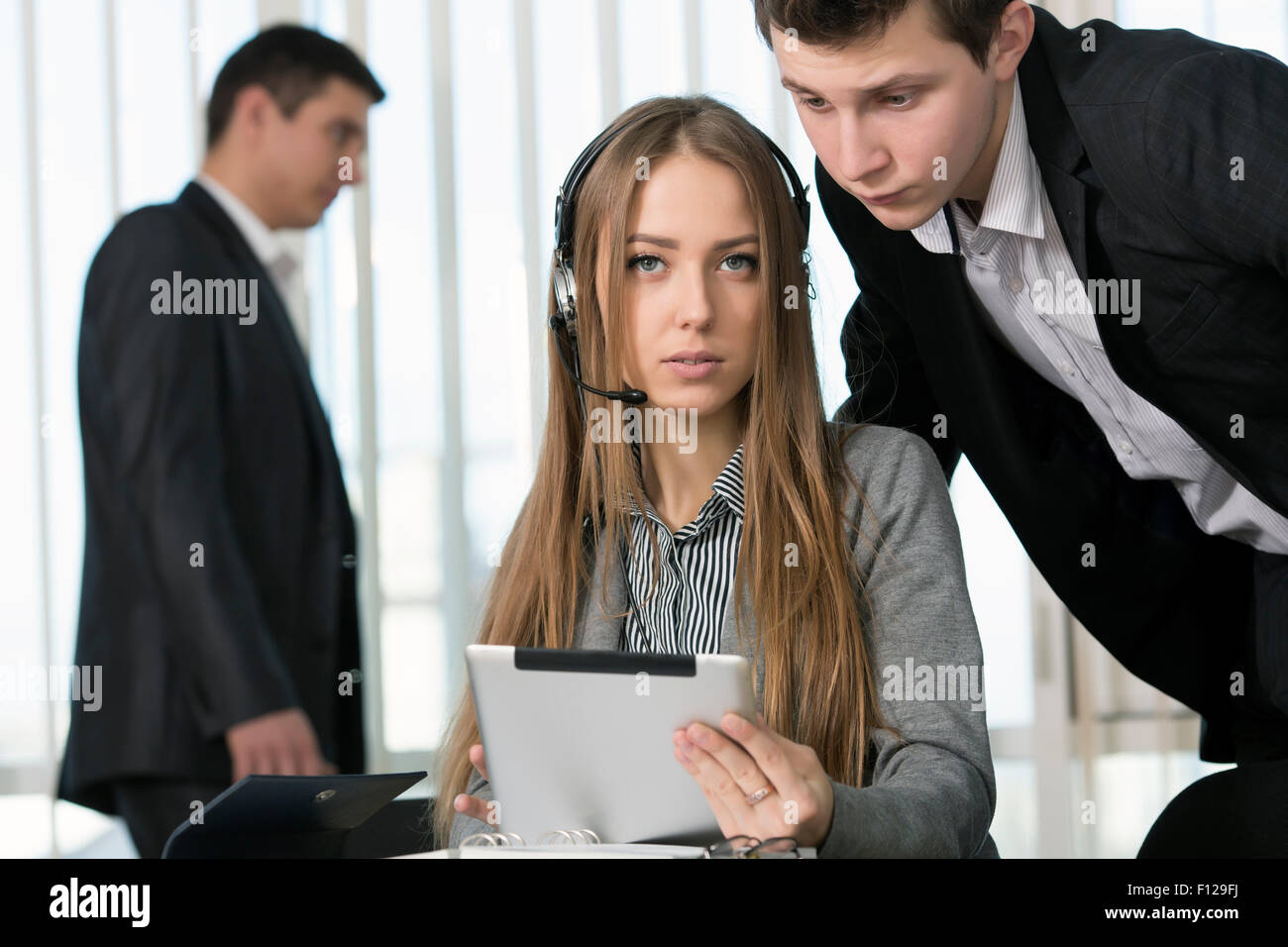 Customer Support Officer and her Boss Stock Photo - Alamy