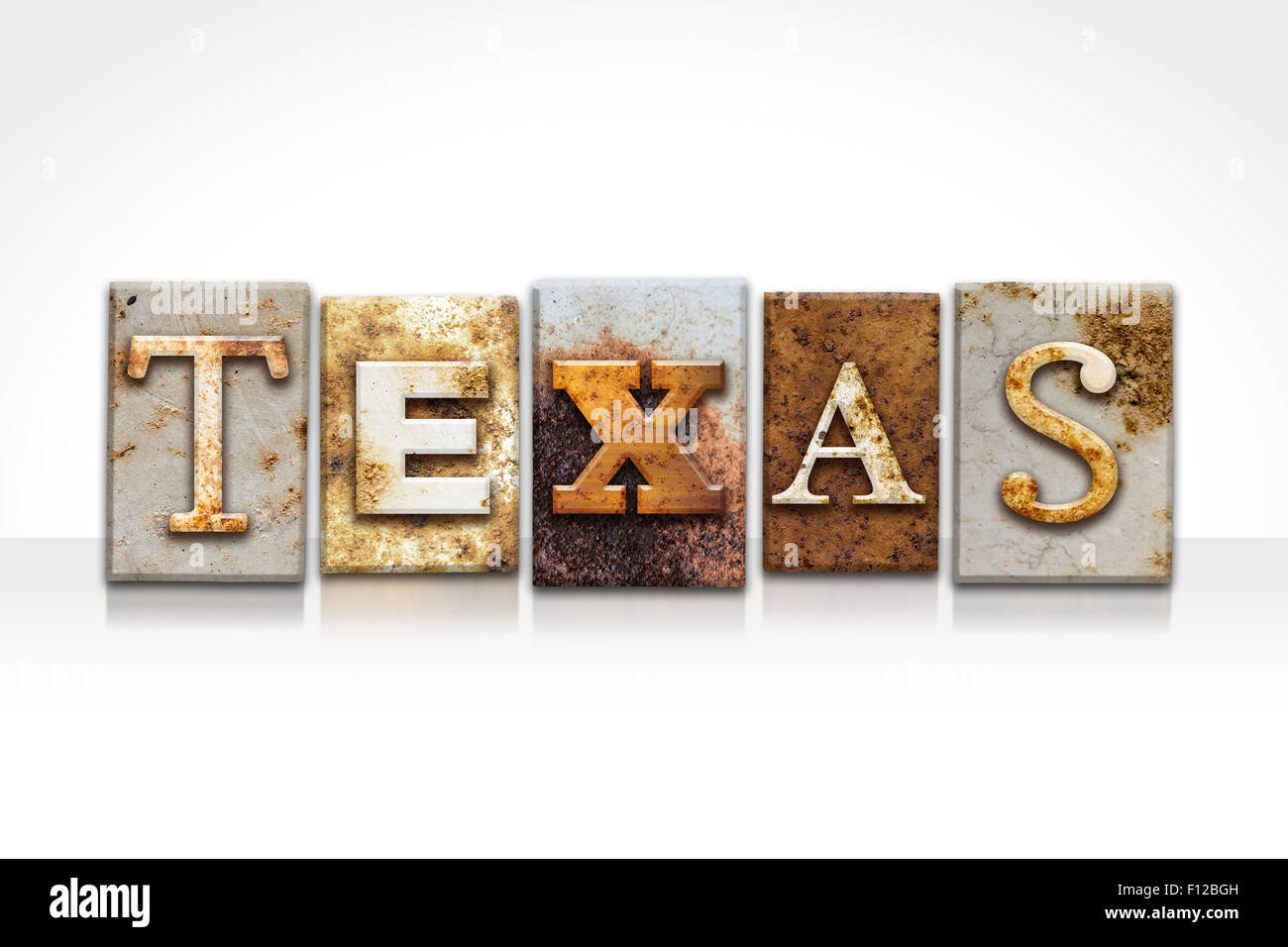 The word "TEXAS" written in rusty metal letterpress type isolated on a ...