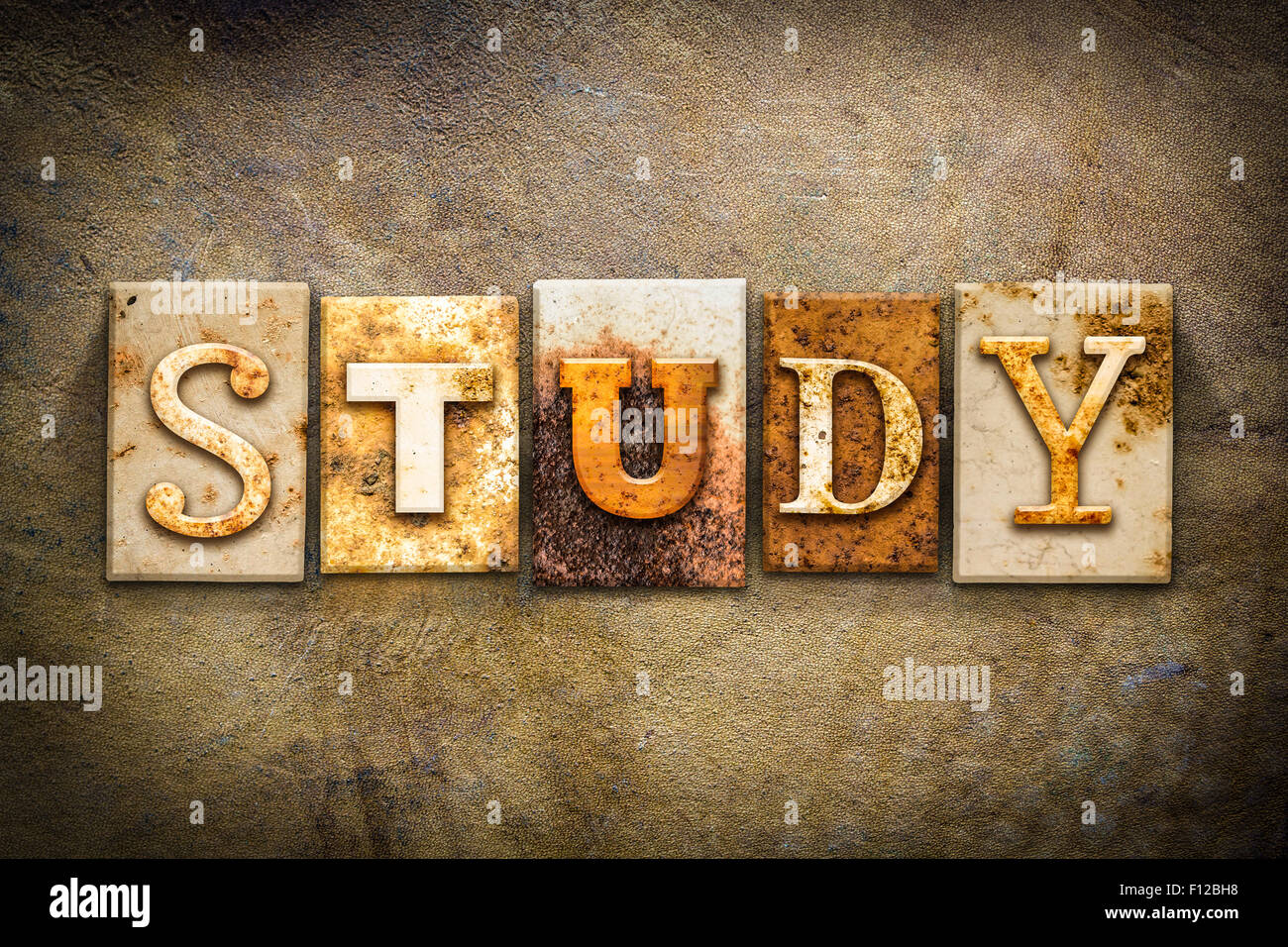 The word "STUDY" written in rusty metal letterpress type on an old aged ...