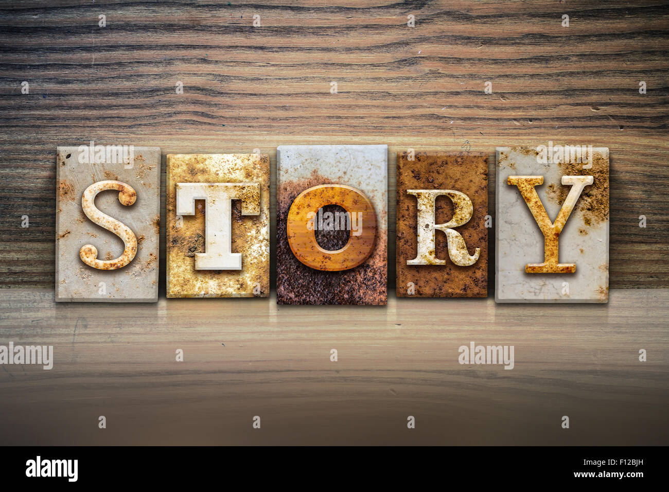 The word "STORY" written in rusty metal letterpress type sitting on a ...