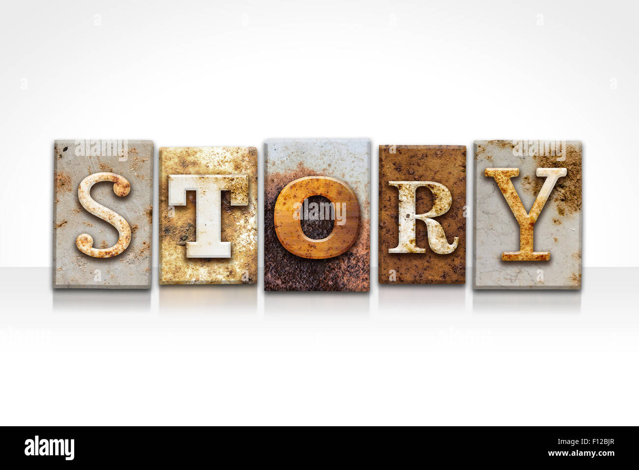 The word "STORY" written in rusty metal letterpress type isolated on a ...