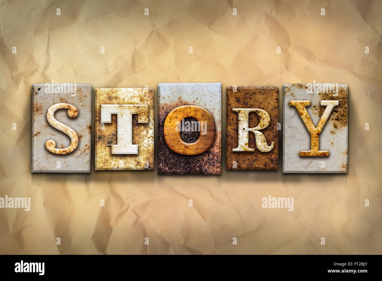 The word "STORY" written in rusty metal letterpress type on a crumbled ...