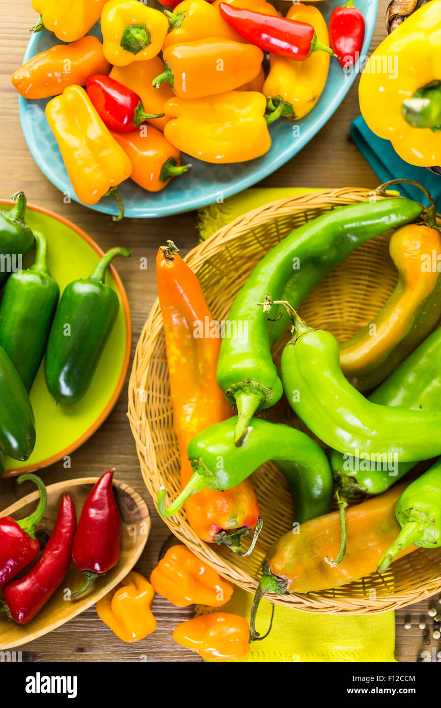 Variety of fresh organic peppers on the table Stock Photo - Alamy