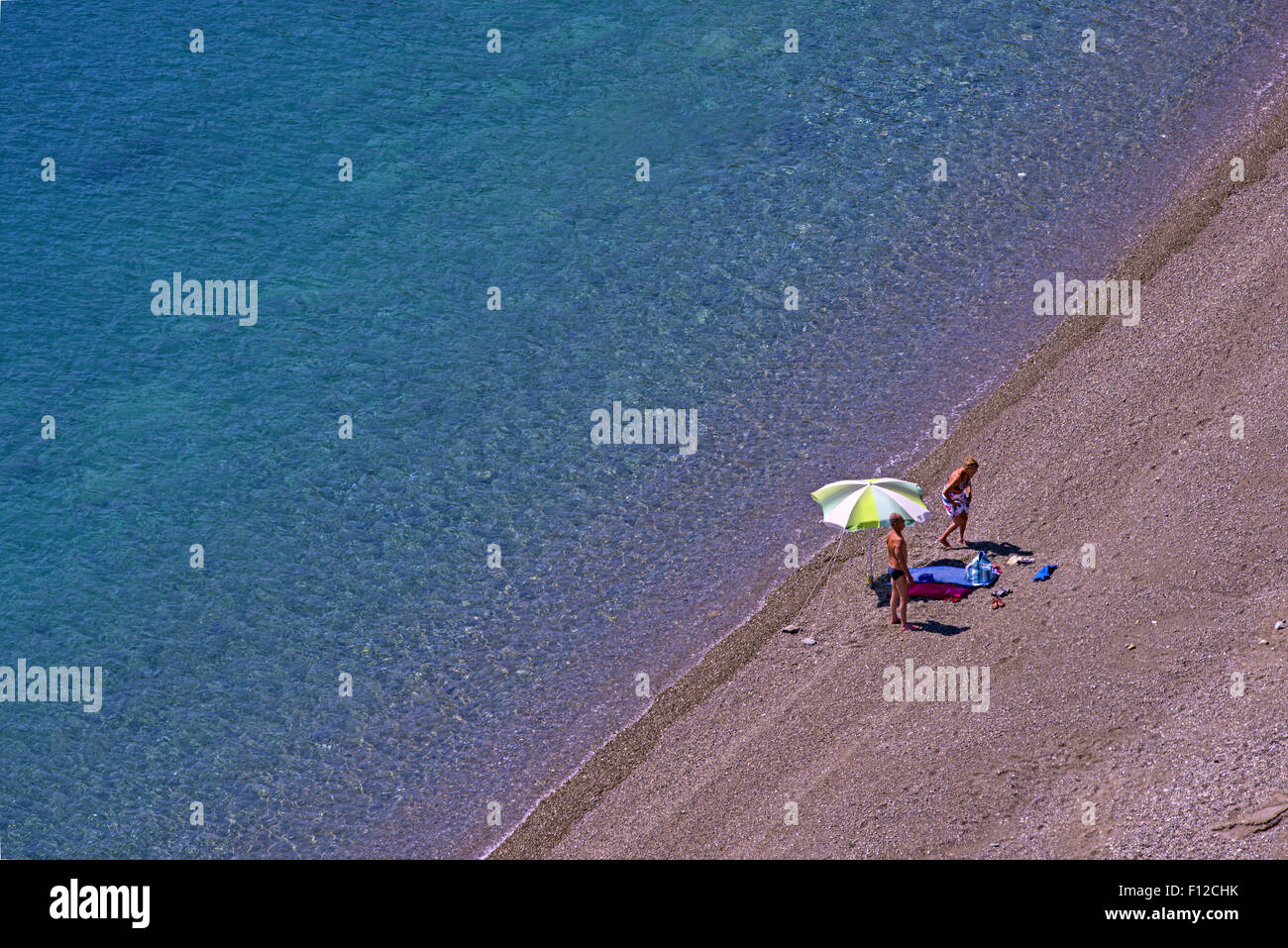 Swimming and sunbathing at Plaka beach located near Leonidio town, in ...