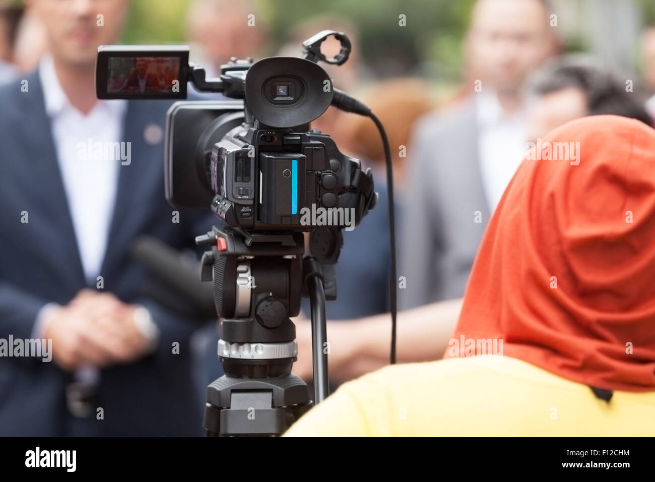 filming an event with a video camera Stock Photo - Alamy