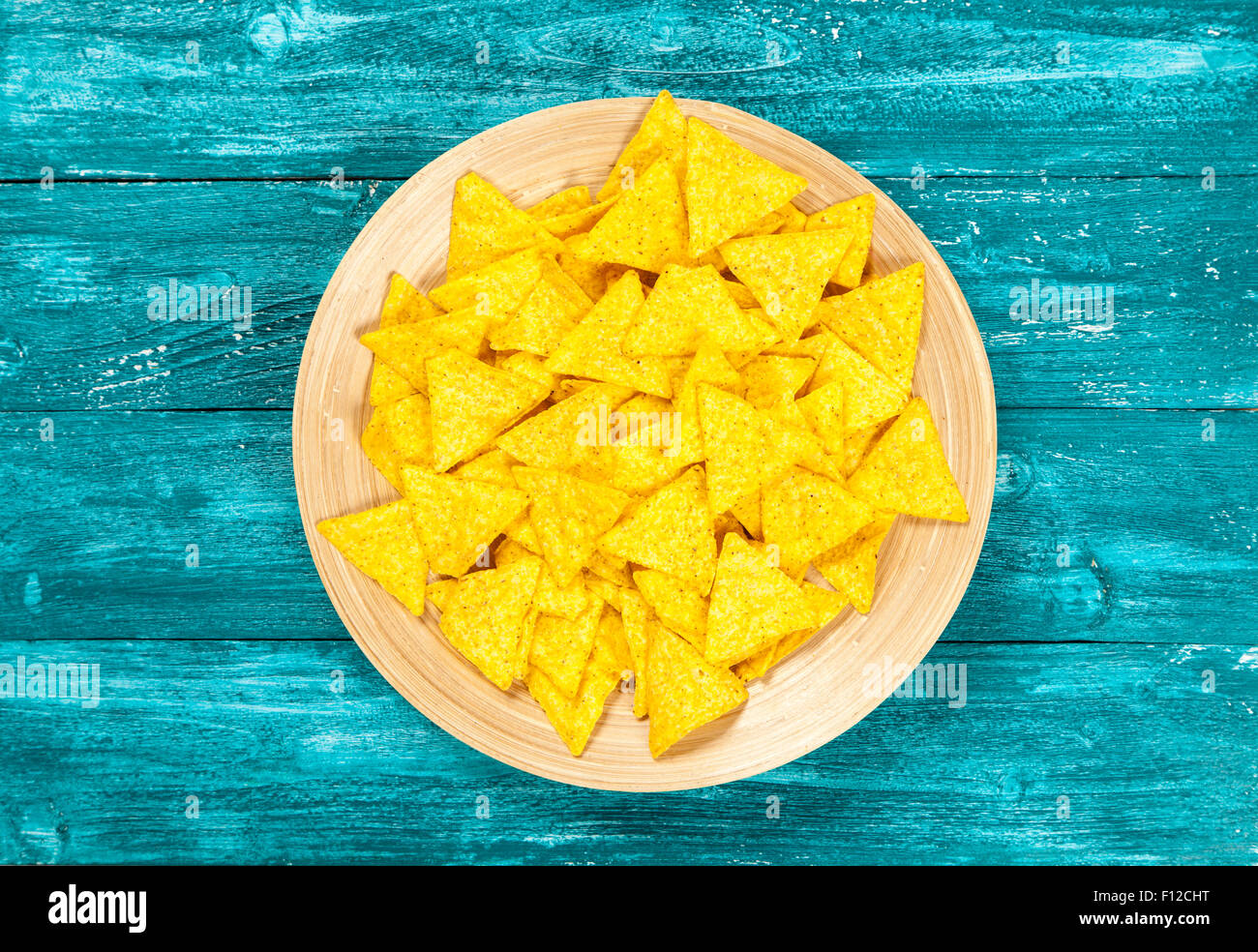 Plate of nachos with different dips Stock Photo - Alamy