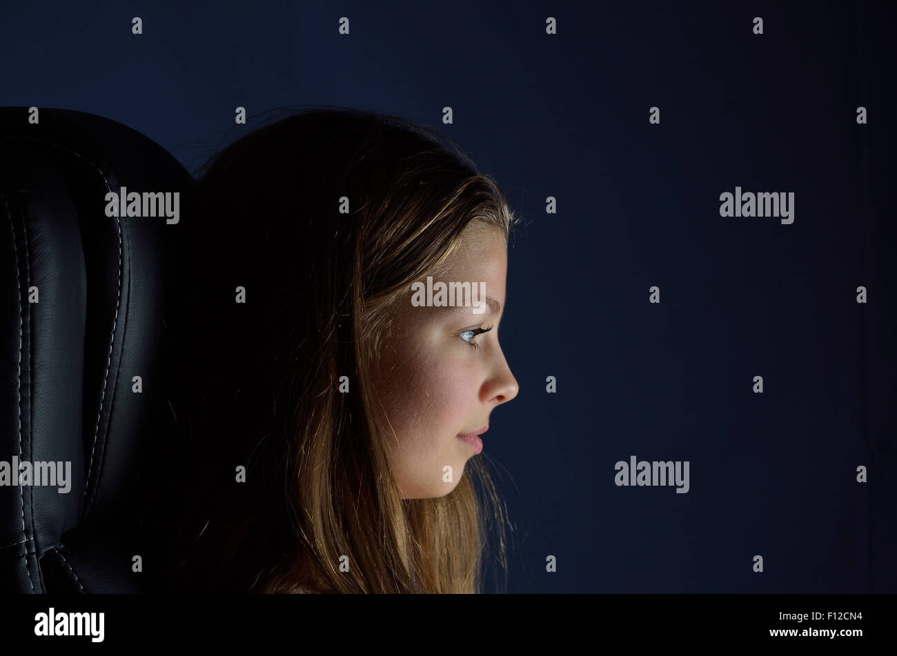 Teenage girl in darkness Stock Photo - Alamy