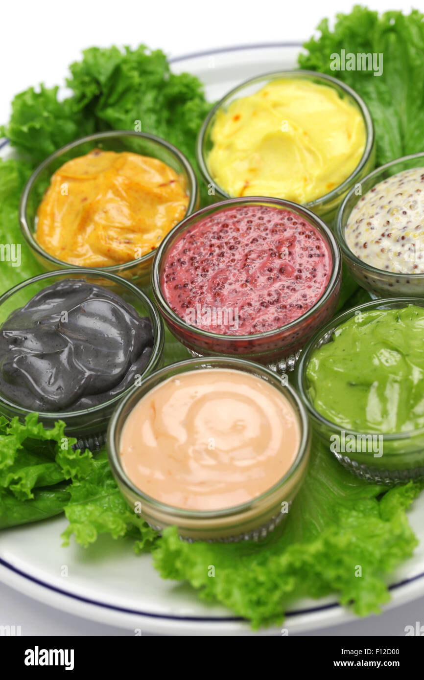 homemade assorted mayonnaise sauce on white background black sesame ...