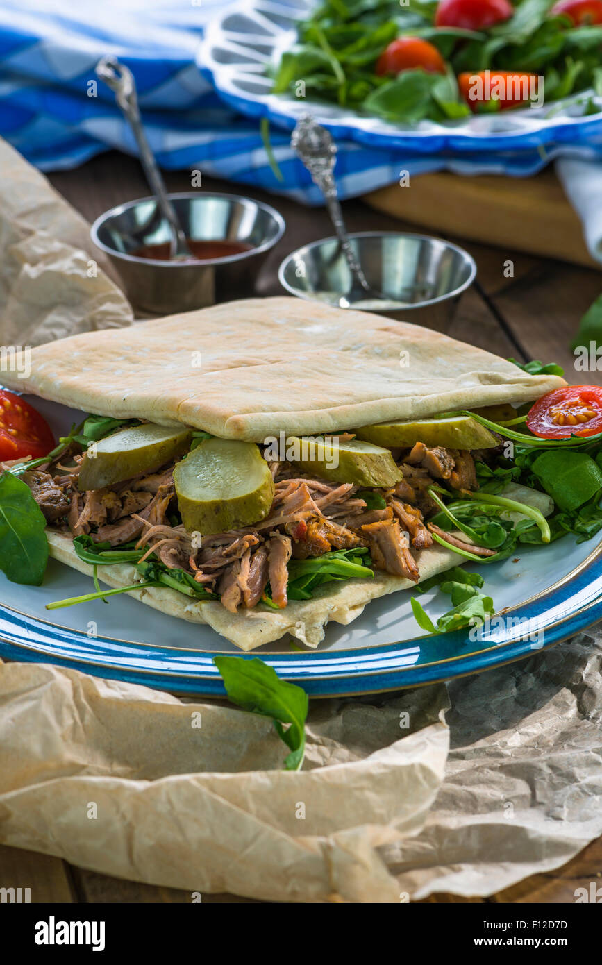 Pulled lamb with fresh rocket salad and pitta bread Stock Photo - Alamy