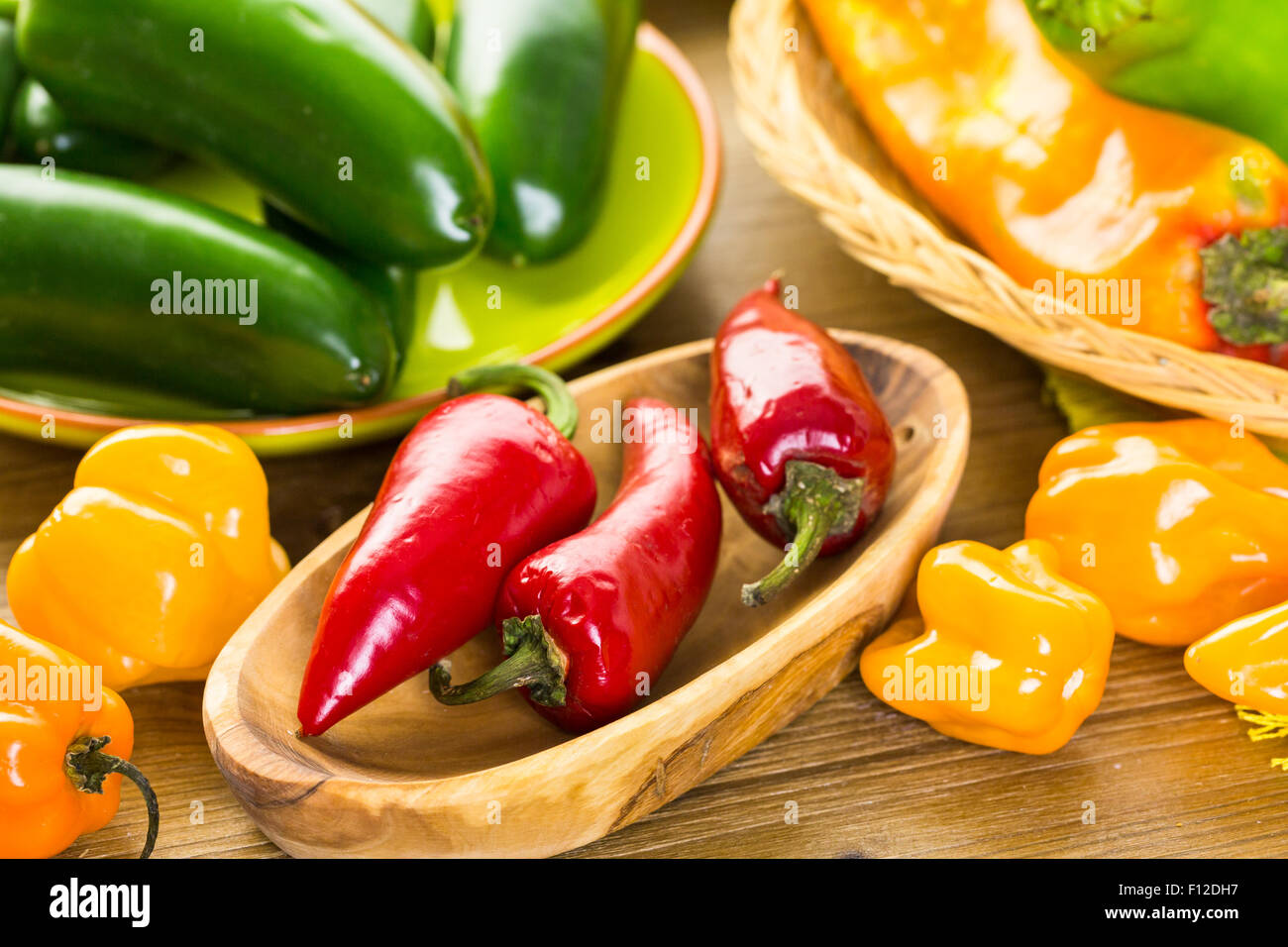 Variety of fresh organic peppers on the table Stock Photo - Alamy