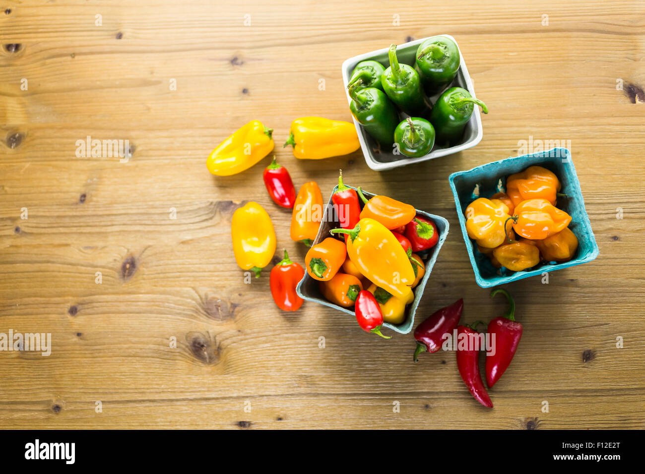 Variety of fresh organic peppers on the table Stock Photo - Alamy