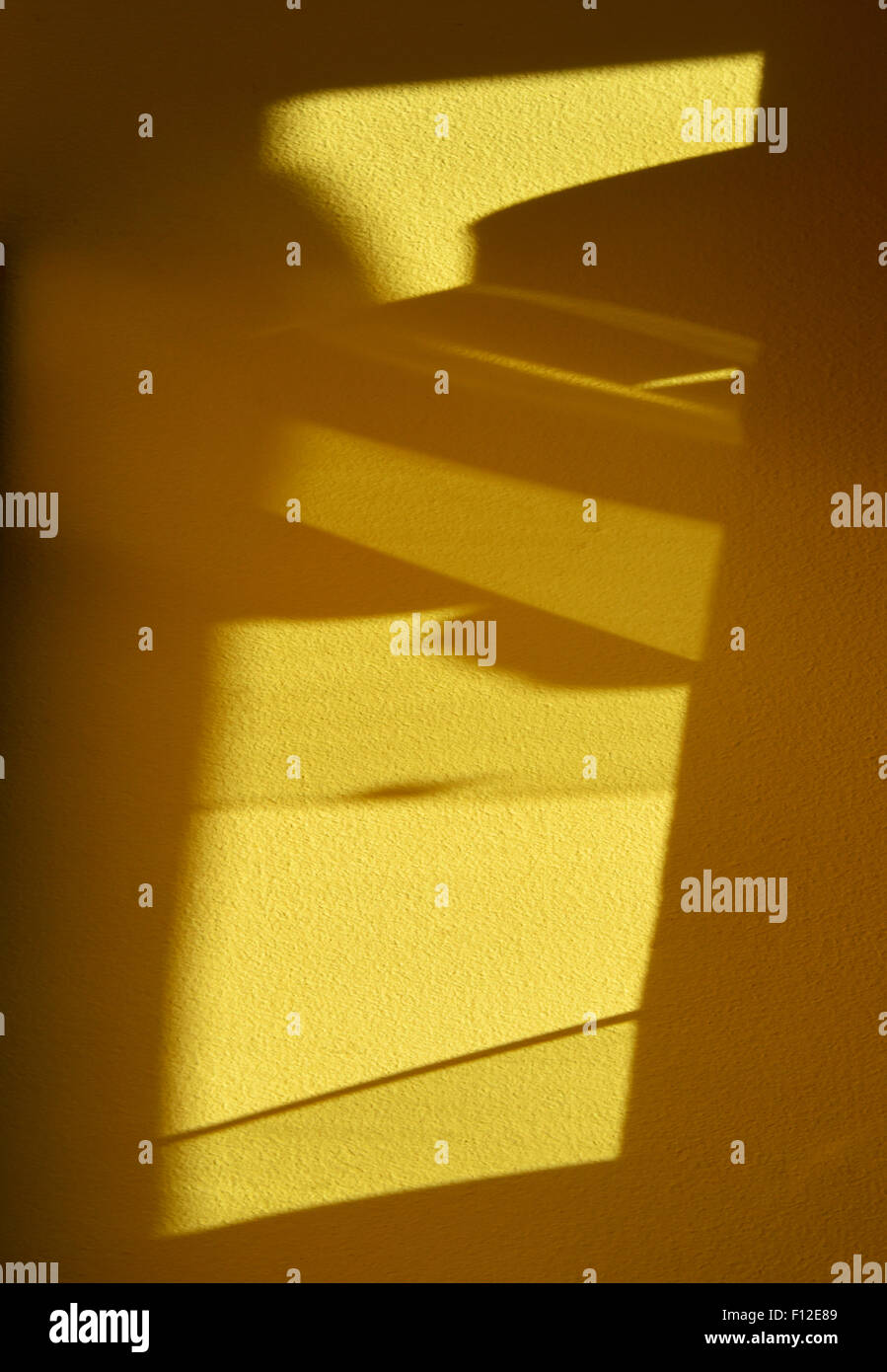 Shadows on yellow wall Stock Photo - Alamy