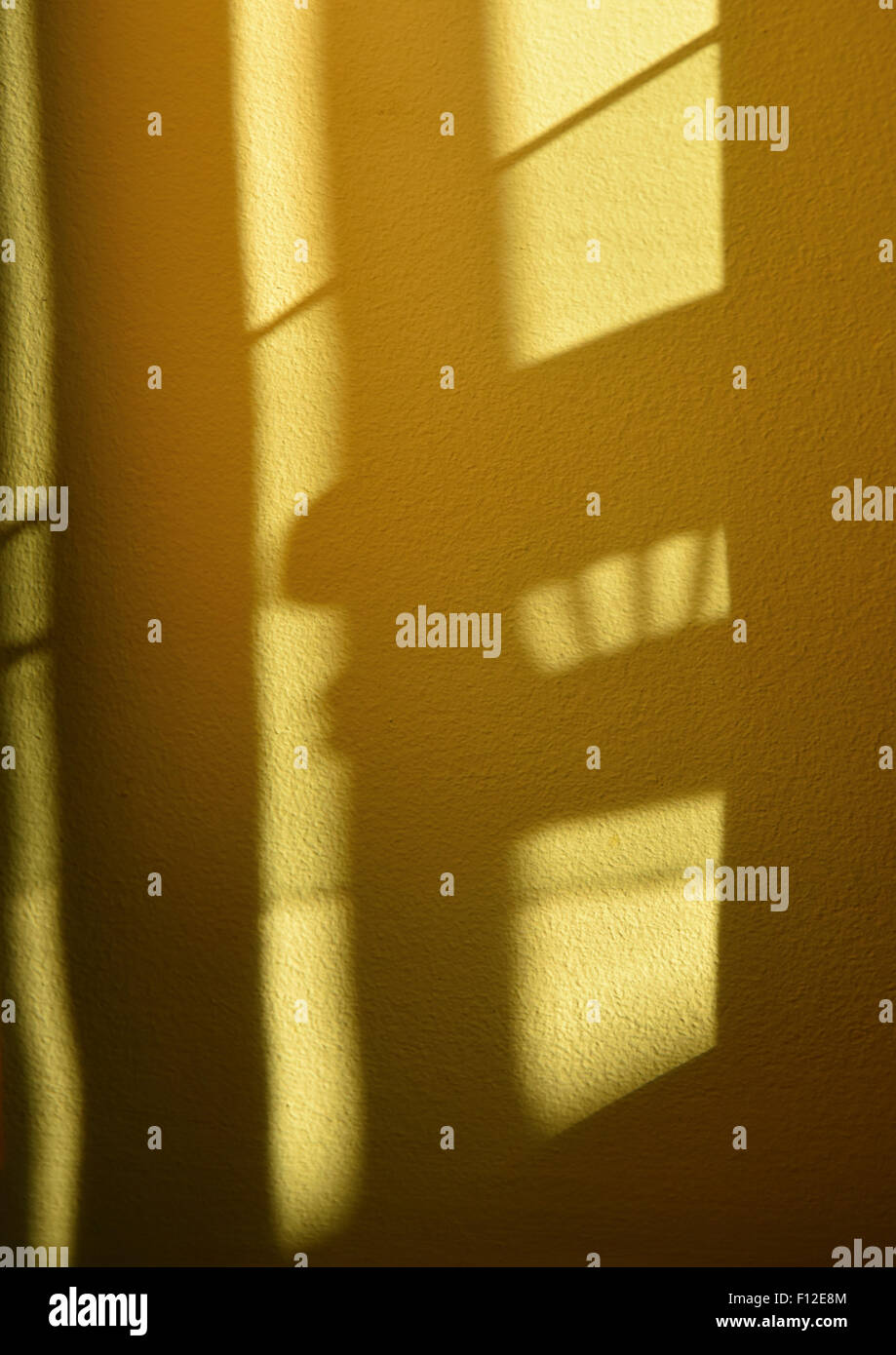 Shadows on yellow wall Stock Photo - Alamy