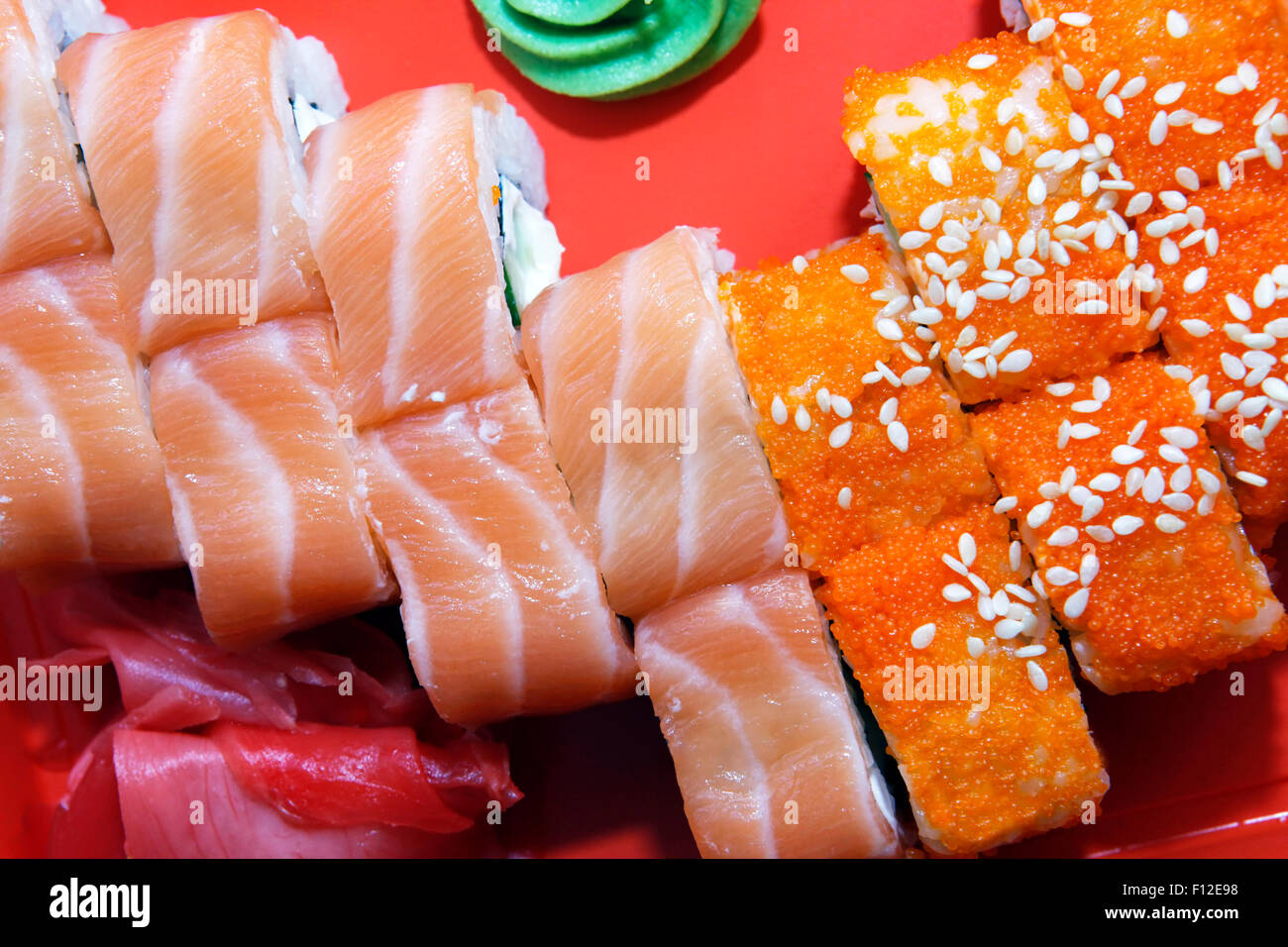 Sushi close-up on red background Stock Photo - Alamy
