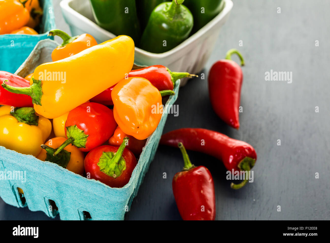 Variety of fresh organic peppers on the table Stock Photo - Alamy