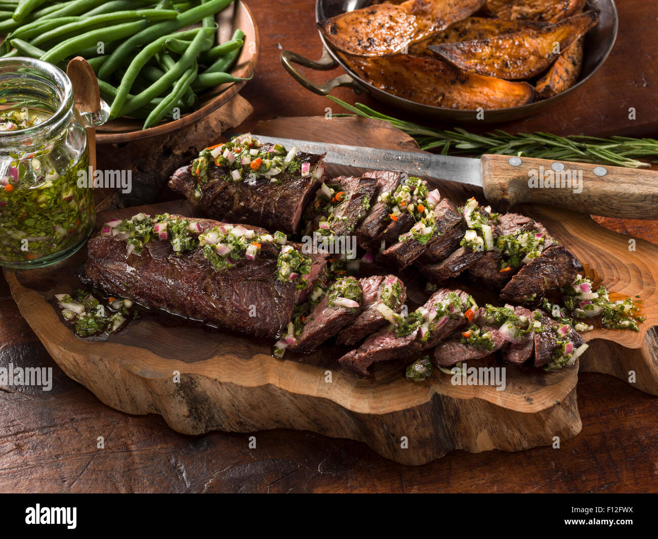 Onglet beef with chimichurri sauce Stock Photo - Alamy