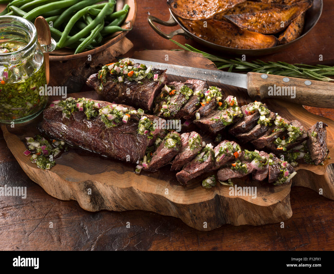 Onglet beef with chimichurri sauce Stock Photo - Alamy