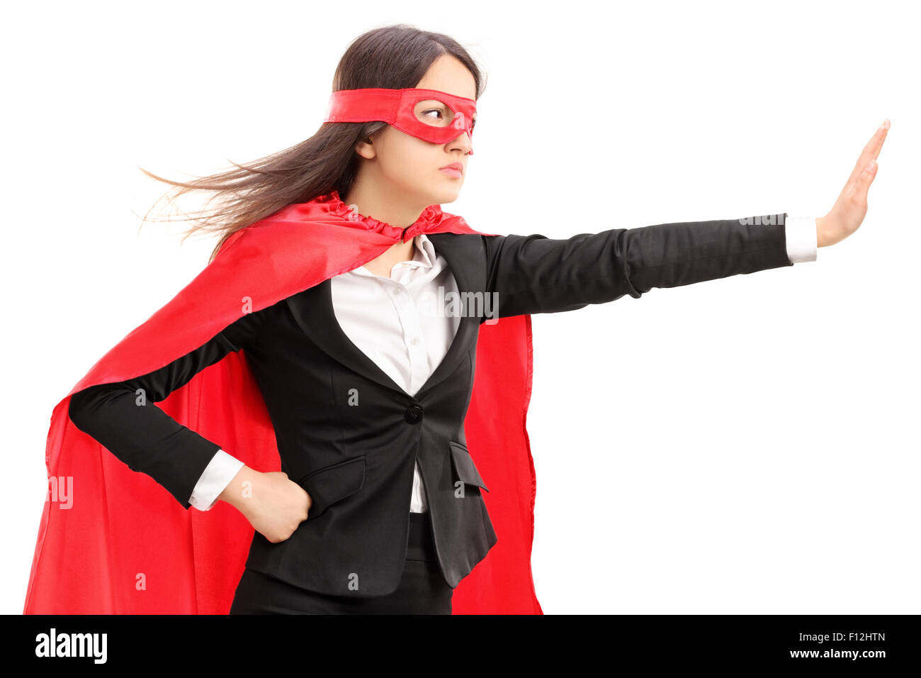 Female superhero making a stop sign with her hand isolated on white ...