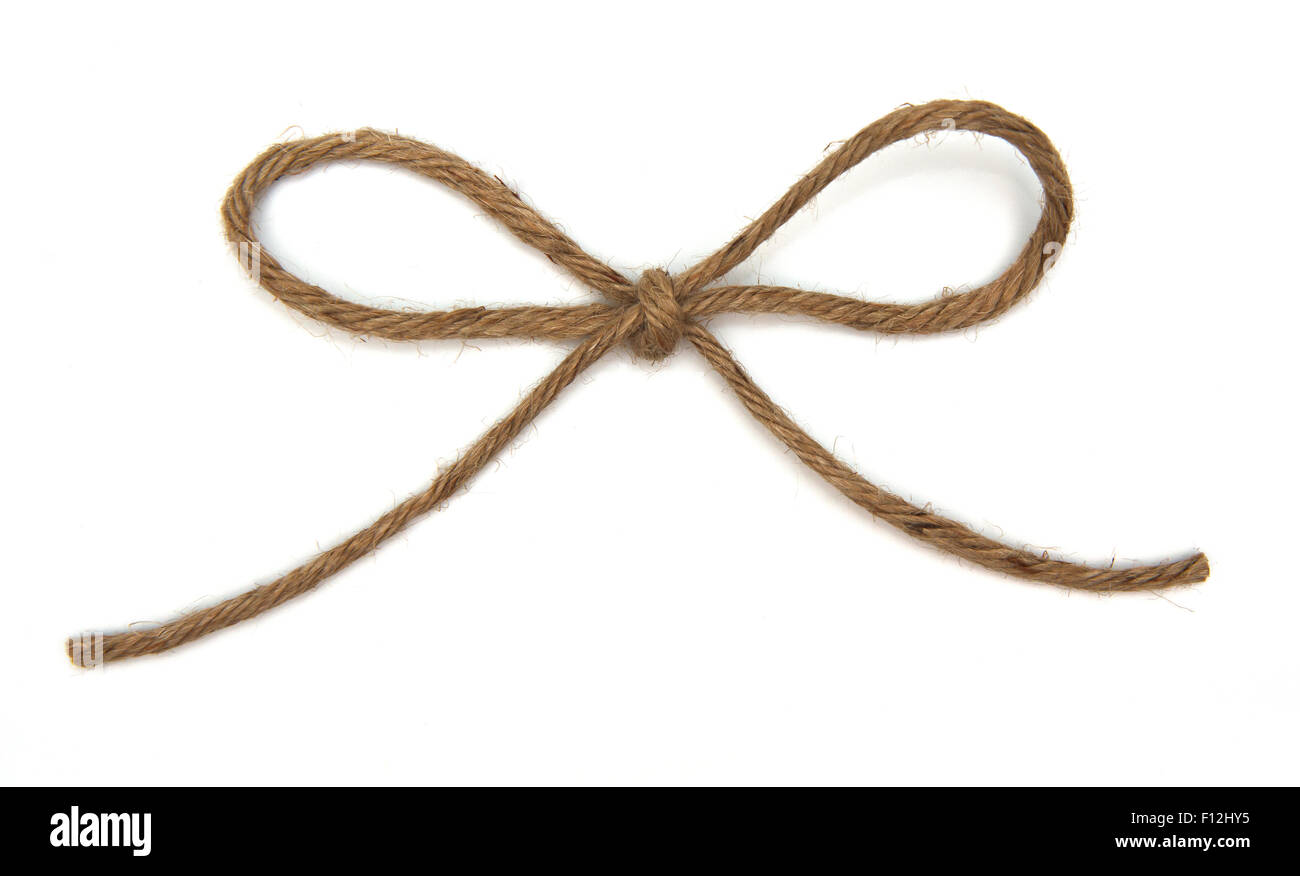 String tied in a bow on white Stock Photo - Alamy