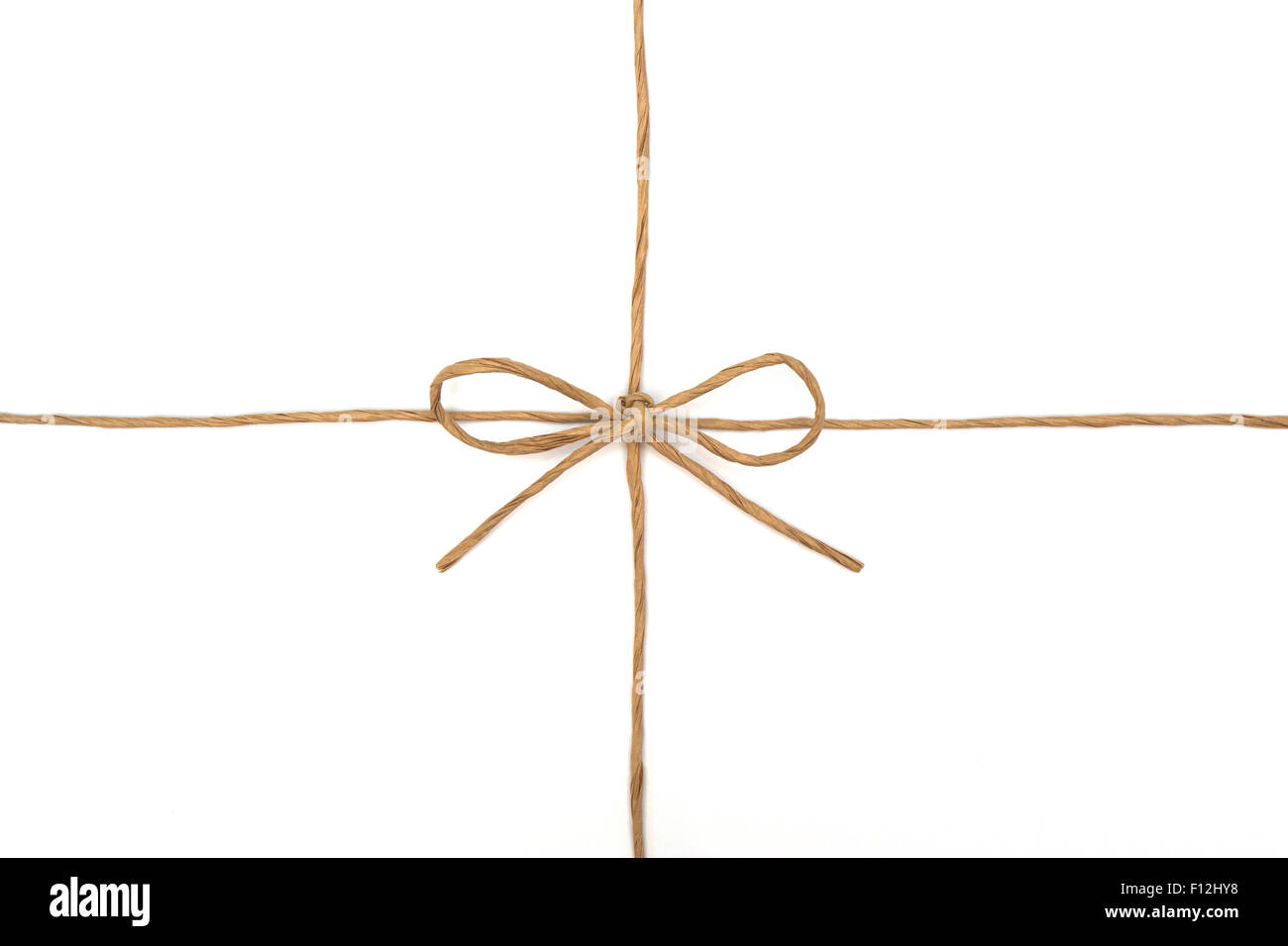 String tied in a bow on white Stock Photo - Alamy
