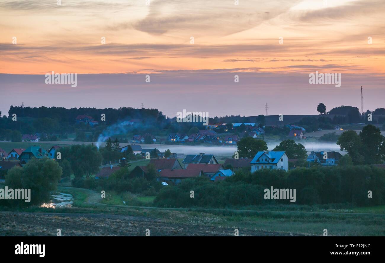 Beautiful and spectacular sunset sky over calm countryside. Polish ...