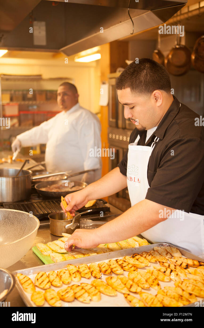 chefs prepare to grill bread for a special dinner, Members’ Dinner at ...