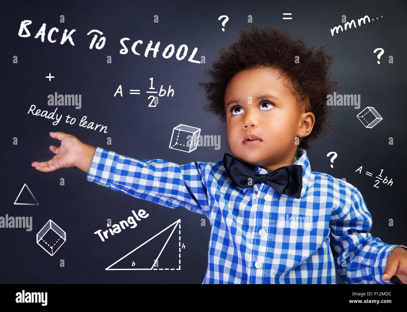 Portrait of smart curly African American schoolboy in the school on ...