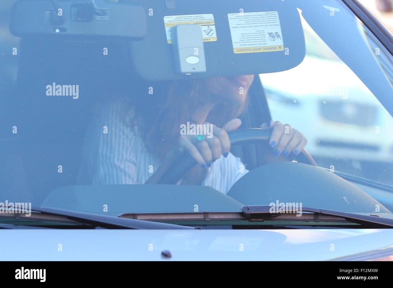Eva Mendes drives her Ford Escape SUV down a one way street on Bedford ...