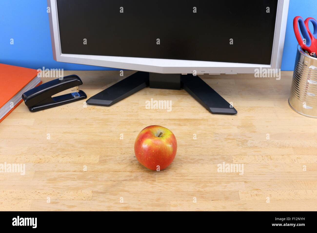 A conceptual image of an apple at a work station Stock Photo - Alamy