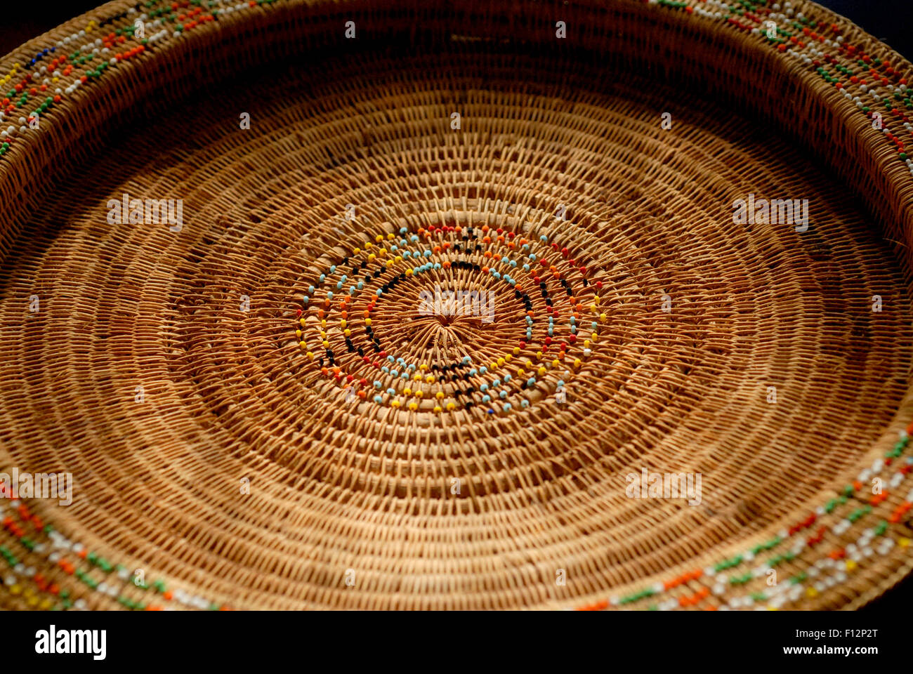 Woven straw and grass beaded basket platter tray from Africa Stock ...