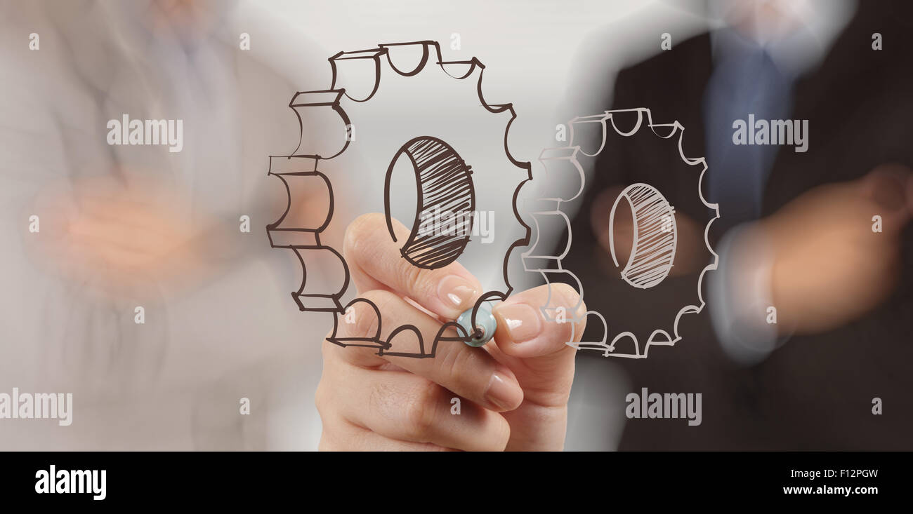 businessman hand draws gear to success concept Stock Photo - Alamy