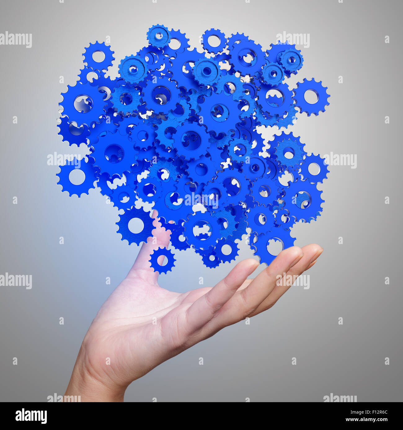 businessman hand showing blue gears cogs to success concept Stock Photo ...
