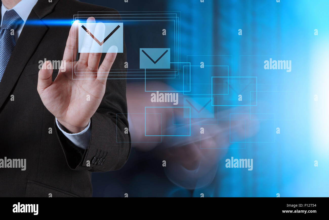 businessman hand use interactive computer with virtual email icon as ...