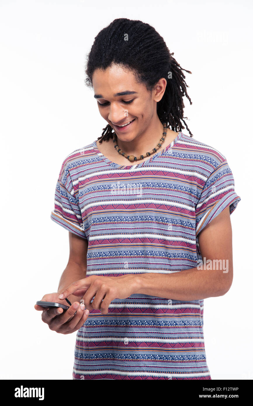 Happy african man using smartphone isolated on a white background Stock ...