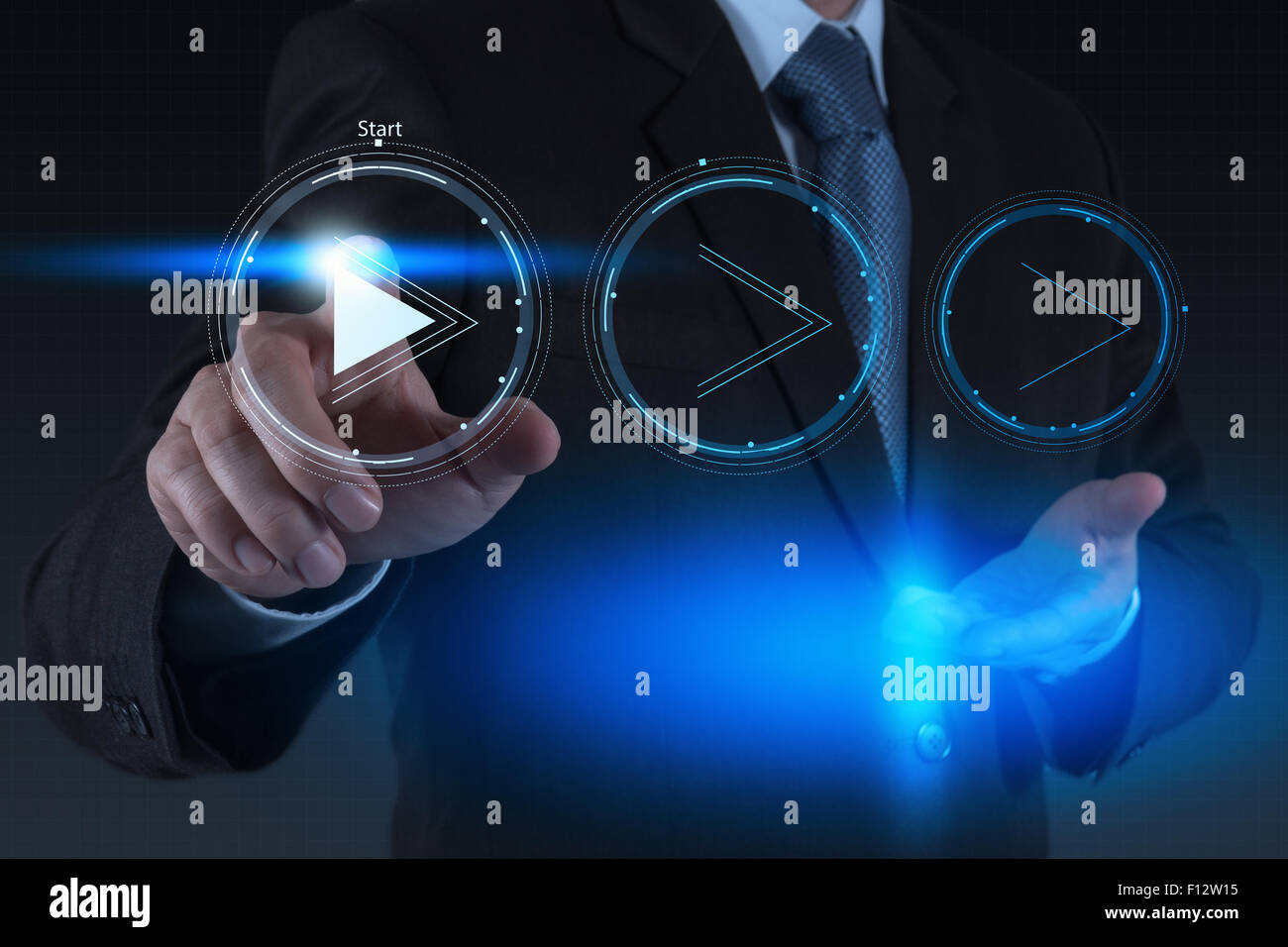 hand press play button sign to start or initiate projects as concept Stock Photo - Alamy